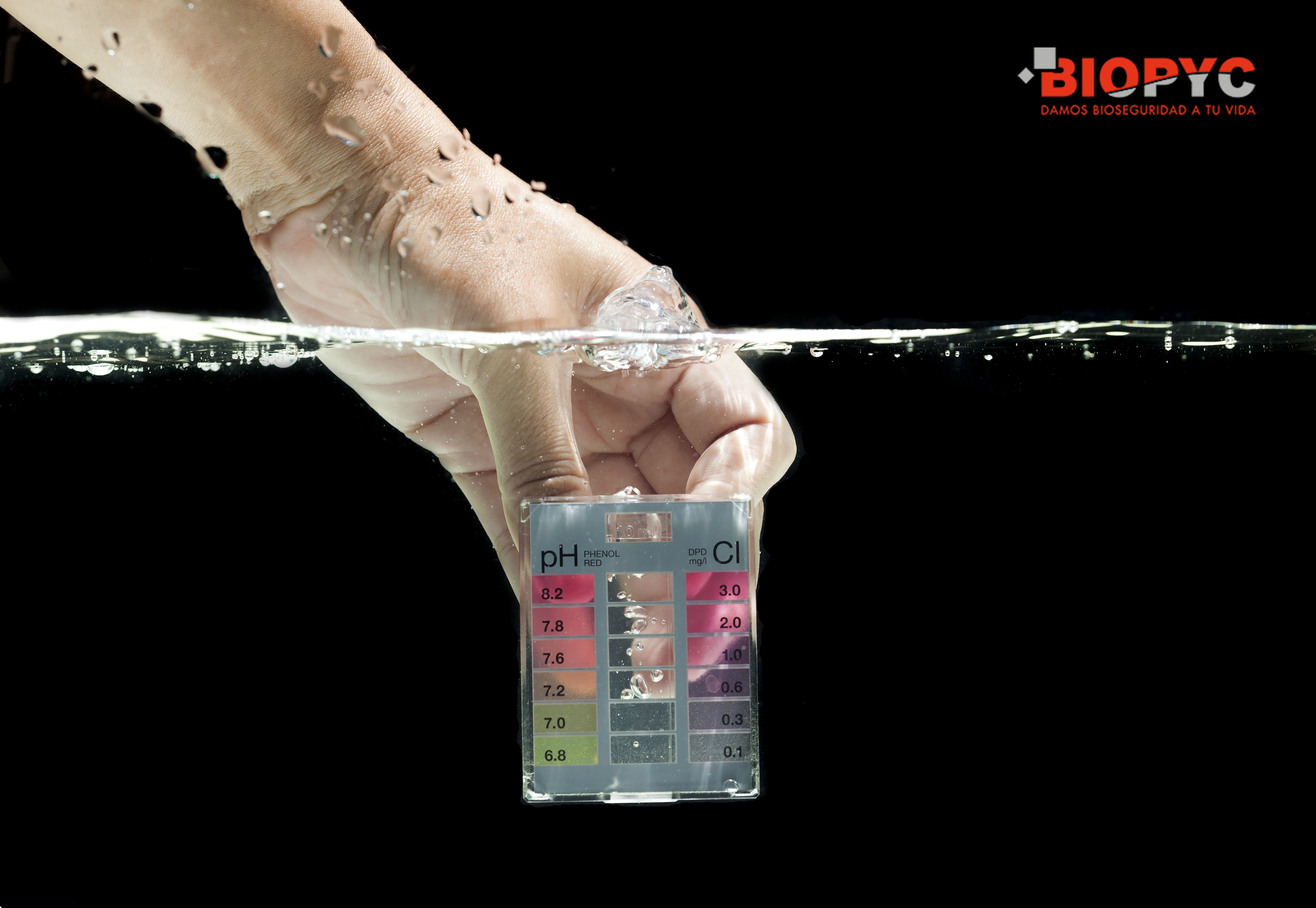 Water testing test kit dipping in water with black background - Biopyc